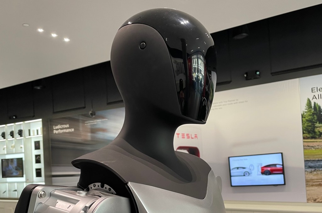 Tesla Bot Up Close – The Last Driver License Holder…